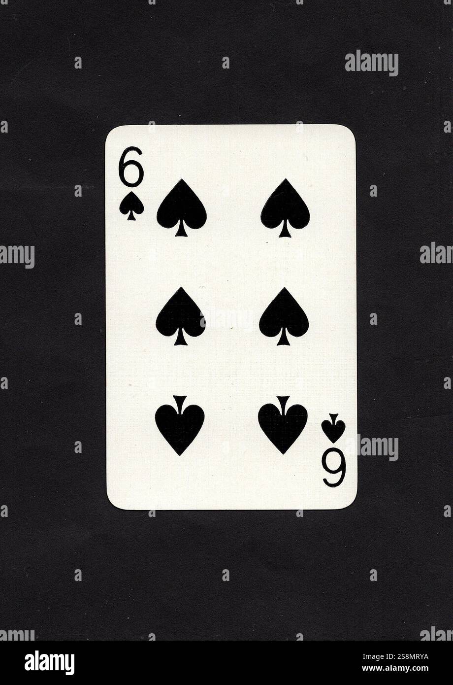 A vintage spades playing card isolated on a black background Stock ...