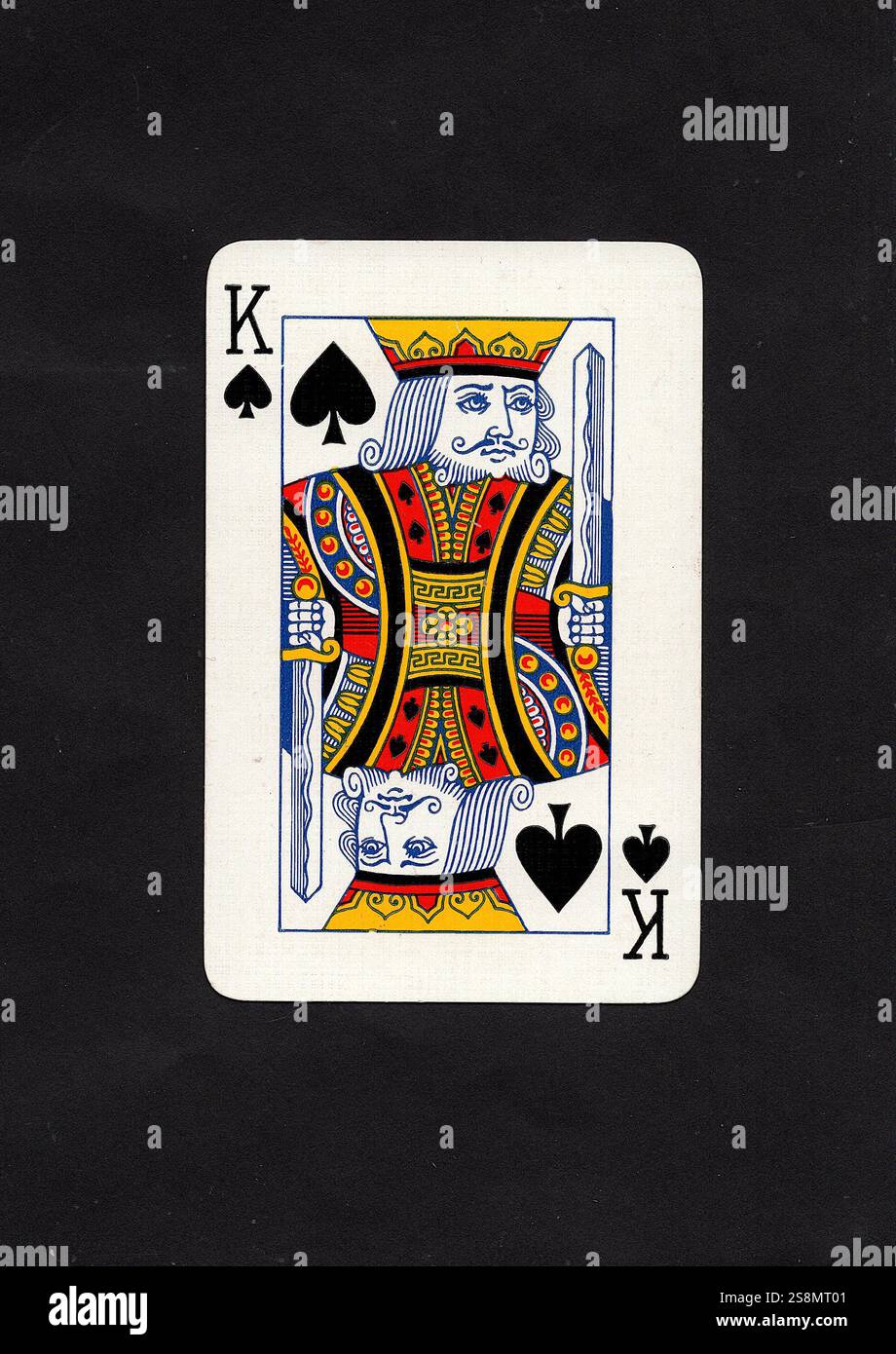 A vintage spades playing card isolated on a black background Stock ...