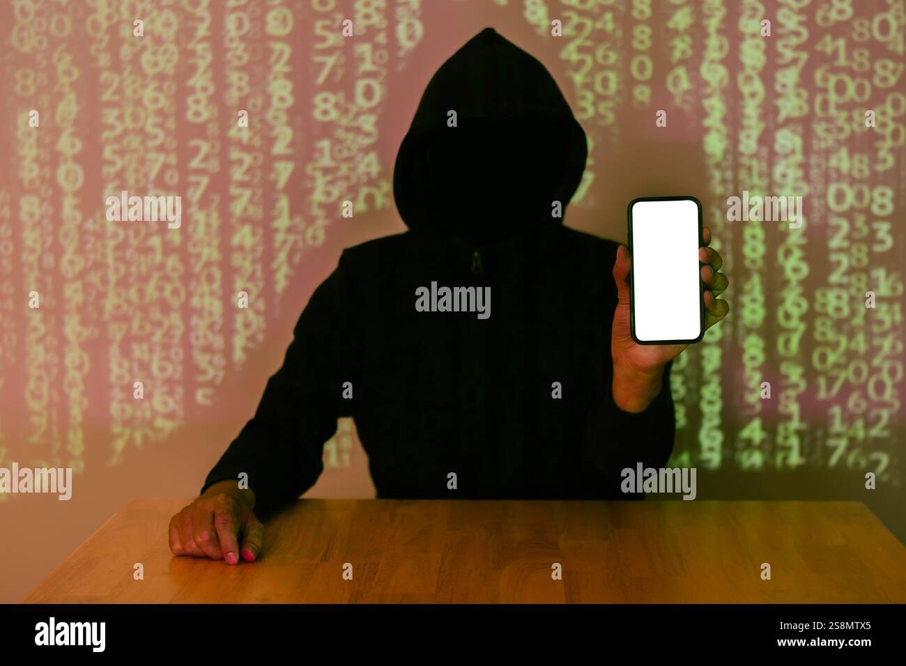 Dark face hacker holding smartphone with isolate screen over binary code digital background ...