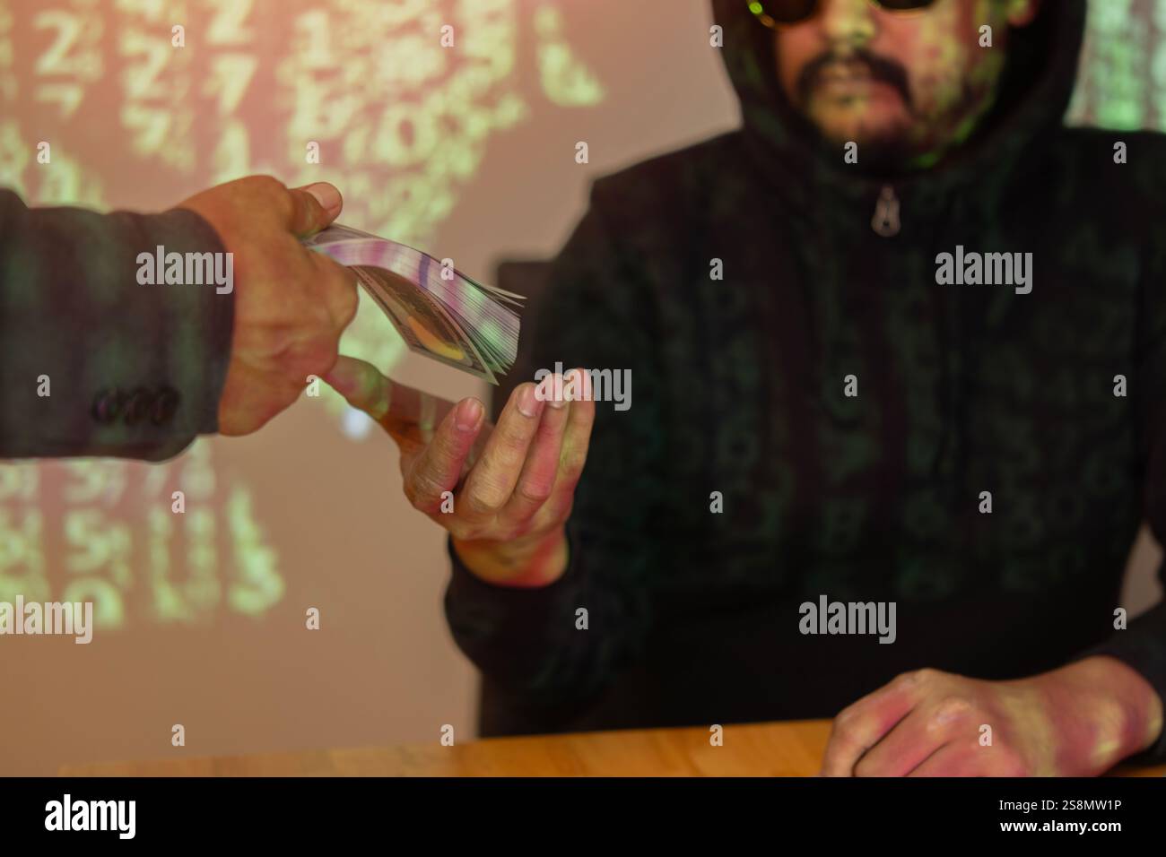 Hacker in a sunglasses with laptop receive money from employers ...