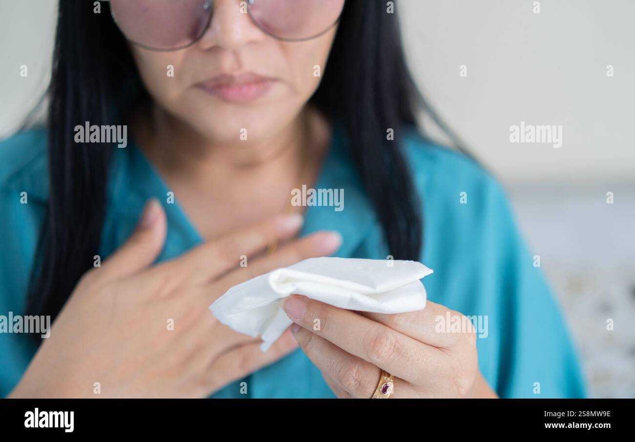 Woman have a coughing up blood and chest pain. Close up of hands ...