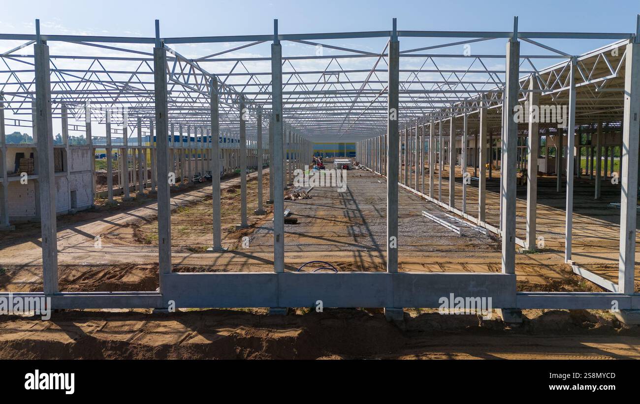 A large construction site featuring a steel framework of a building ...