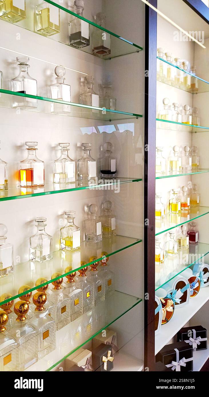 The shelves of a perfume store, on which there are bottles with samples ...