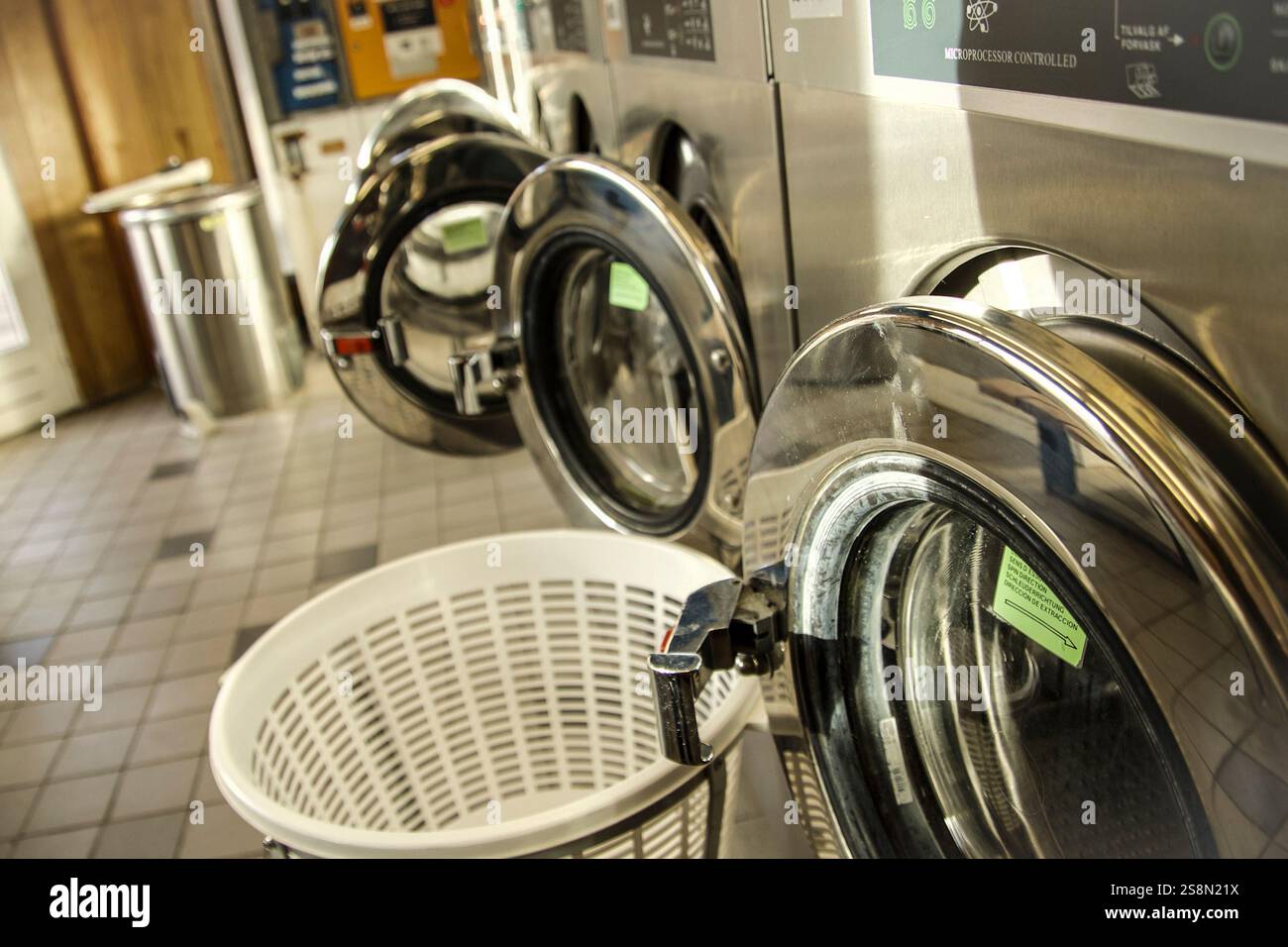 Washing machines seen inside self service laundry. (Photo by Kristian ...