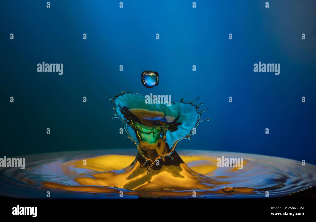 Arresting, ethereal, colour infused, imaginative water collision, macro ...