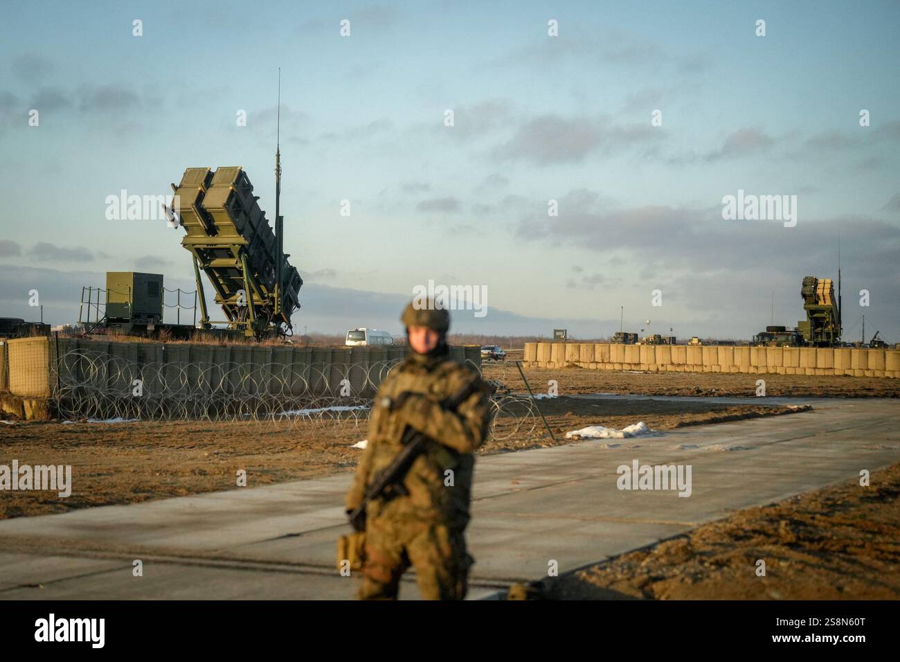 23 January 2025, Poland, Rzeszow: Bundeswehr soldiers guard the Patriot ...