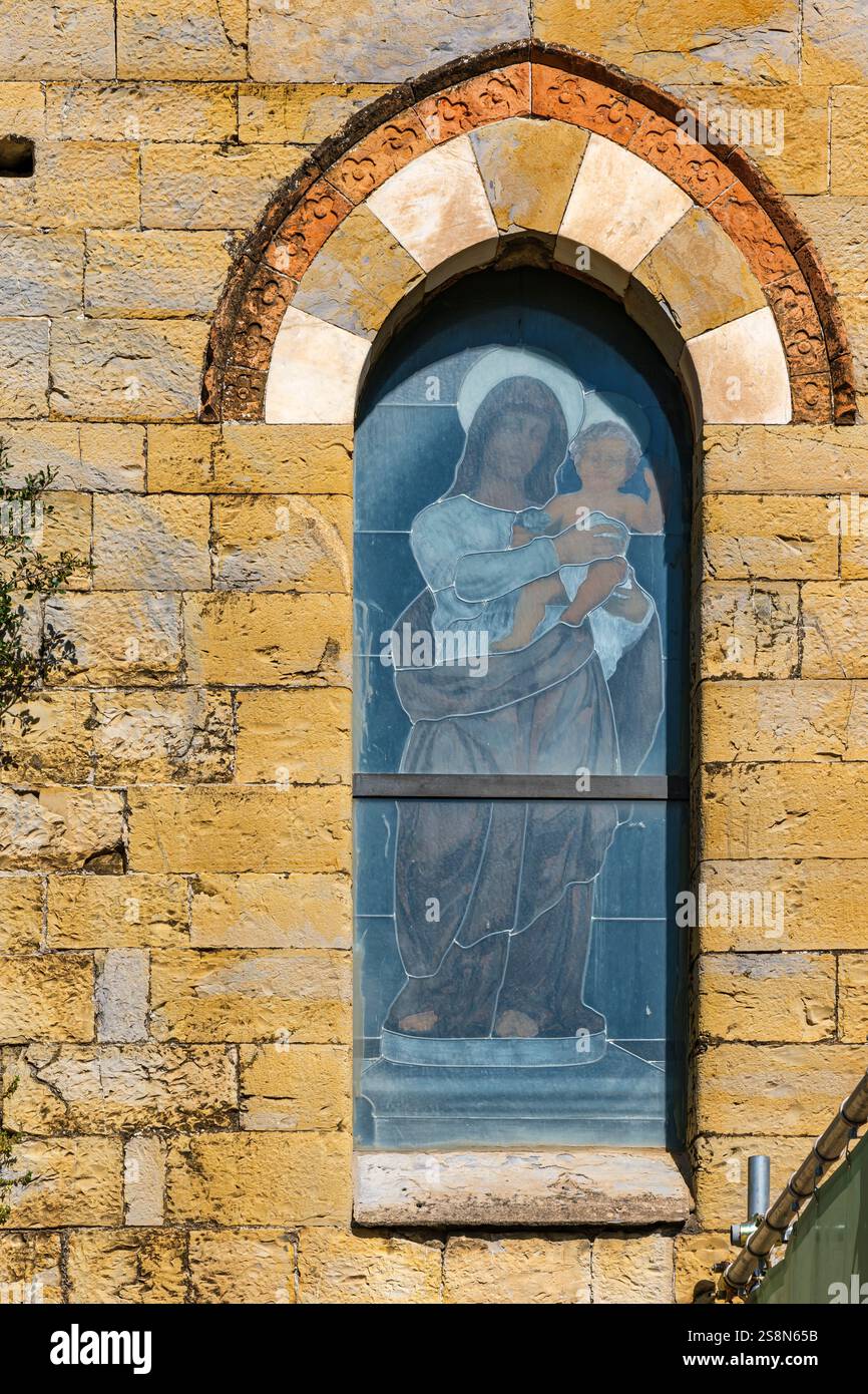 Arched window in the west facade of the Chiesa SS. Giacomo e Filippo, a ...