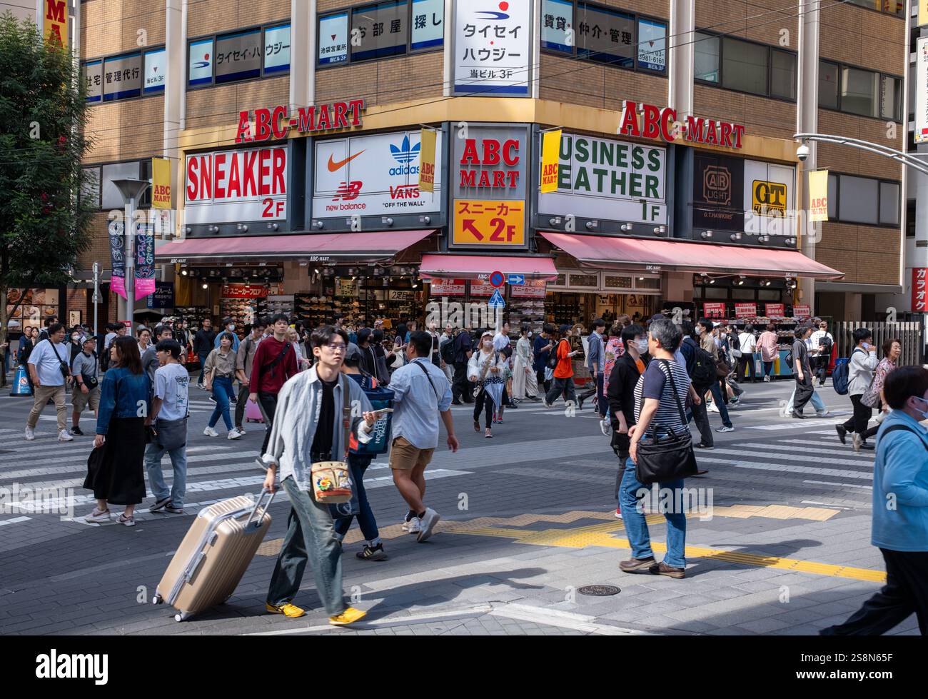ABC Mart and Pedestrian Crossing in the shopping district of Ikebukuro ...