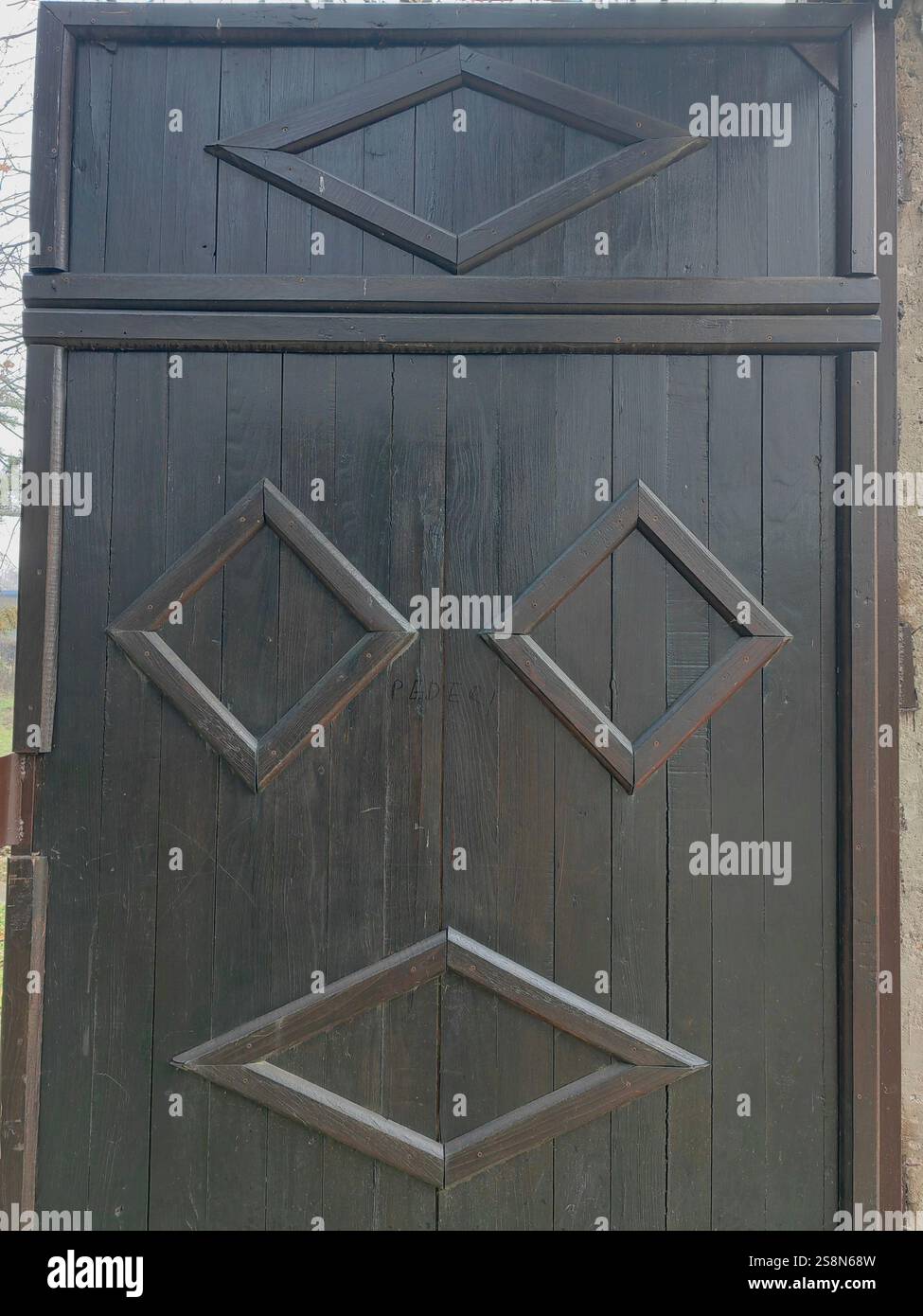 The Silent Observer: Abstract Face in Wooden Door Frame Stock Photo - Alamy
