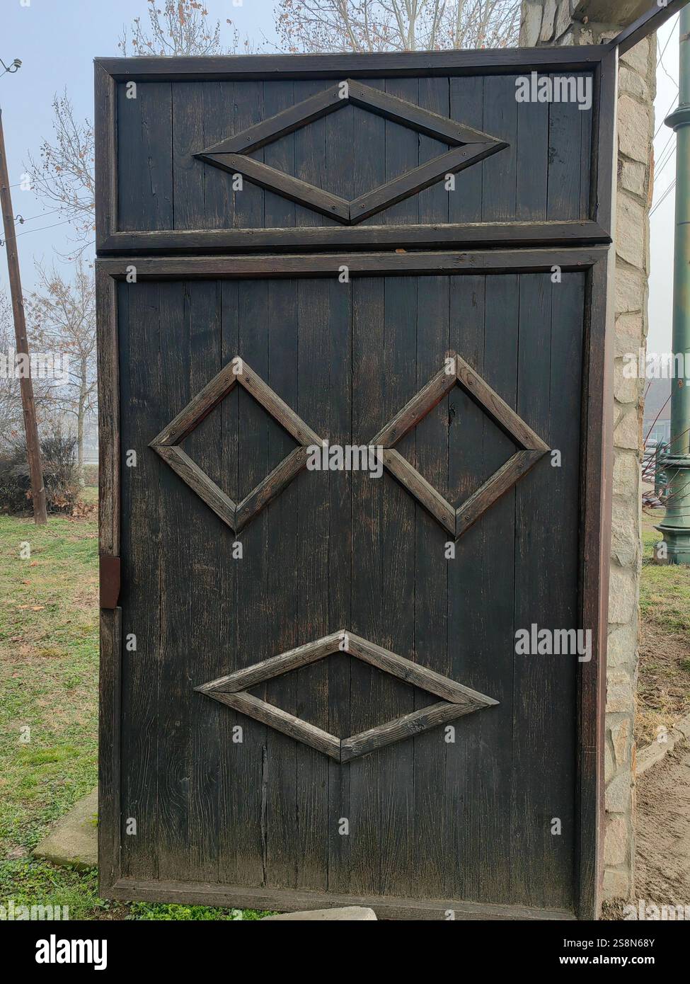 The Silent Observer: Abstract Face in Wooden Door Frame Stock Photo - Alamy