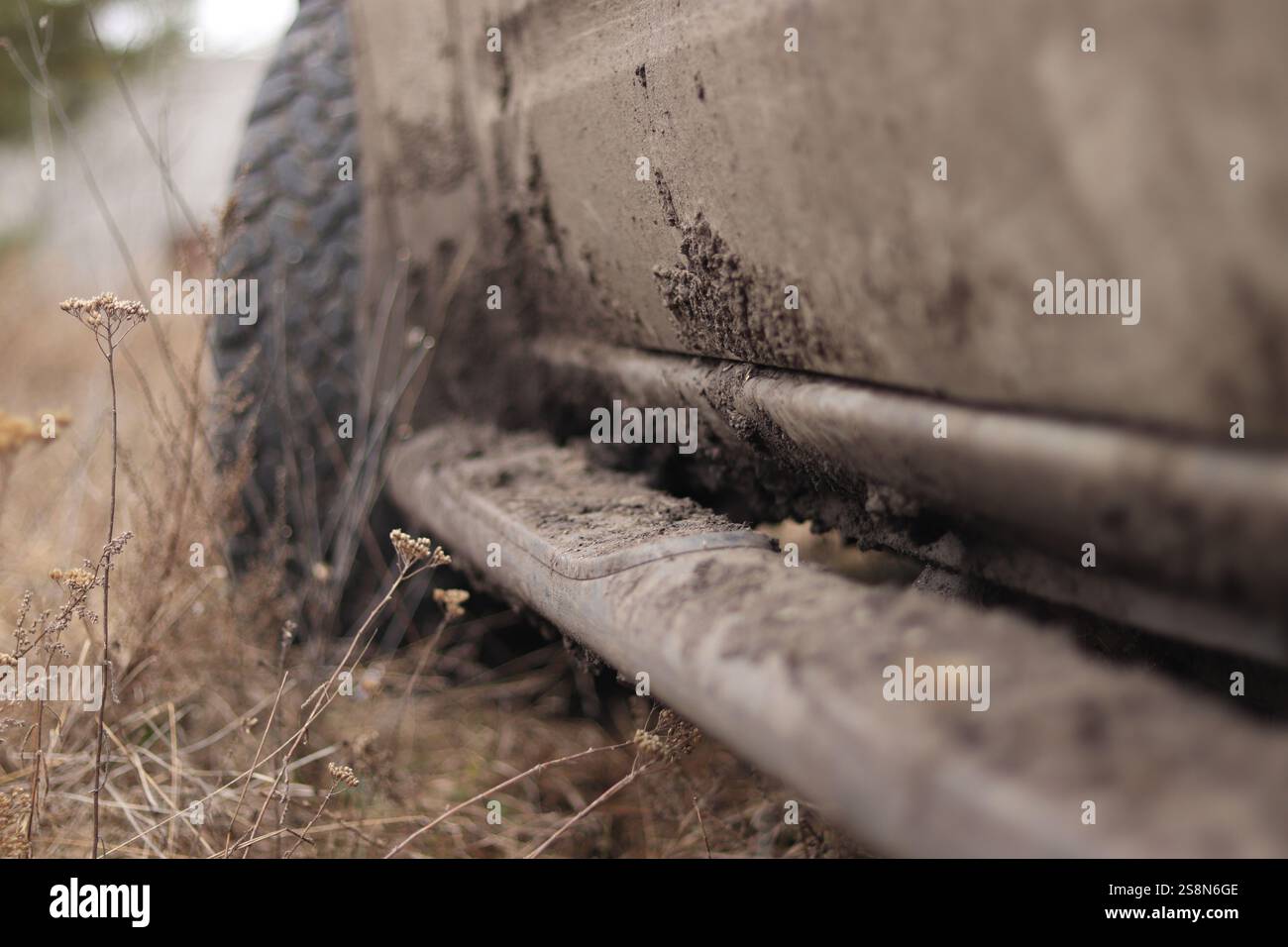 Pickup truck in mud, off-road tires, close-up. Car wheel on dirt road ...