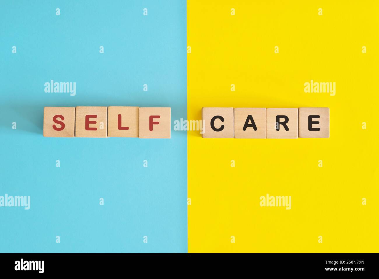 Self care reminder and awareness wooden blocks typography in bright ...
