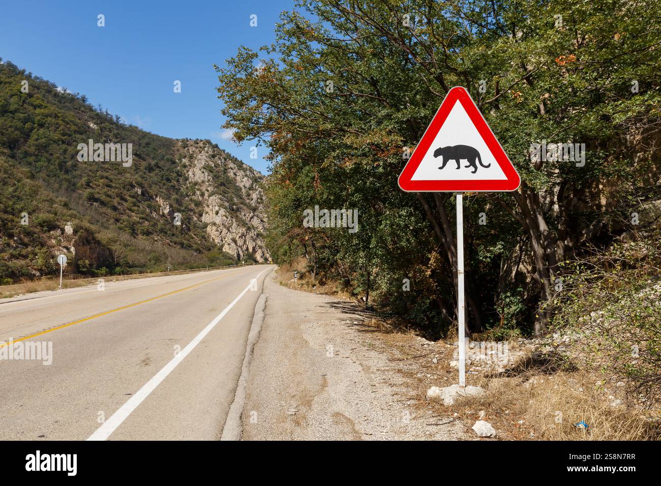 A warning sign alerts drivers to wildlife crossing on the Gorgan ...
