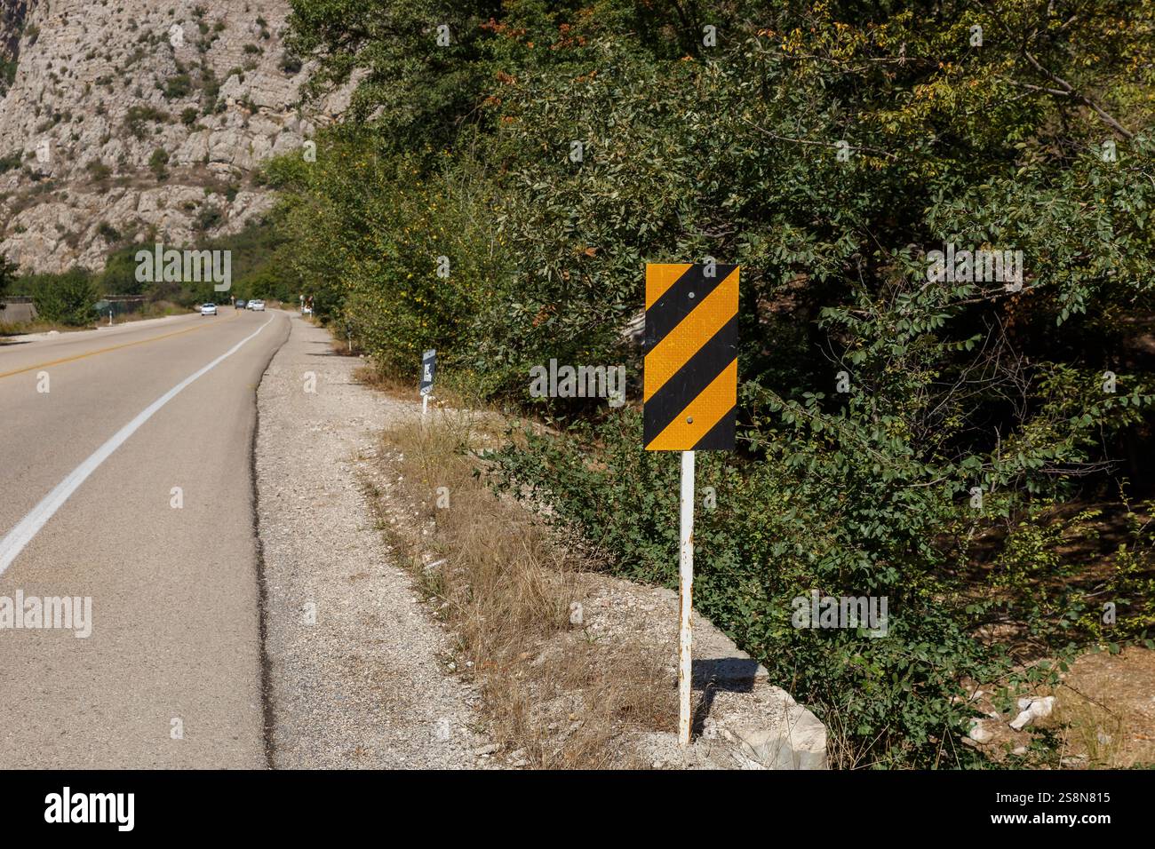A traffic warning sign stands beside the Gorgan Bojnord road ...