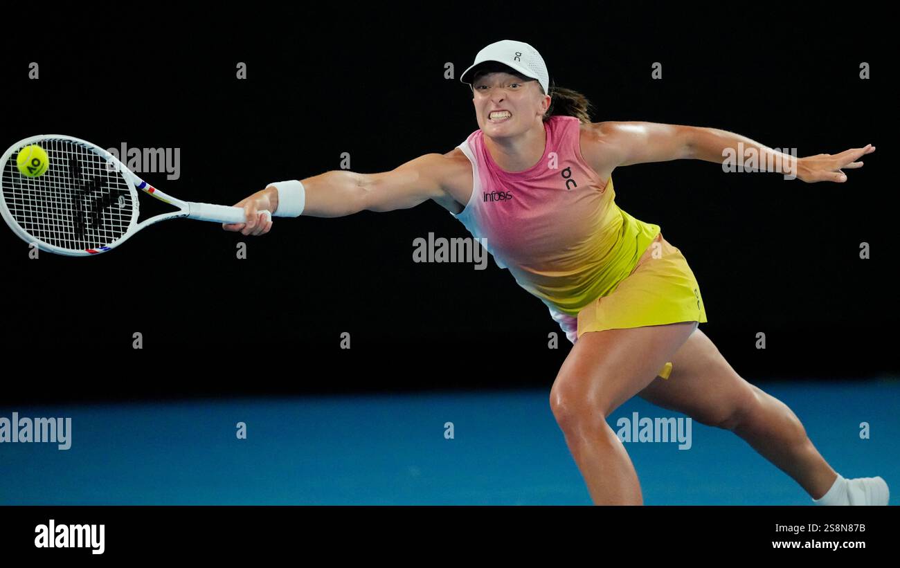 Iga Swiatek of Poland plays a forehand return to Madison Keys of the U ...