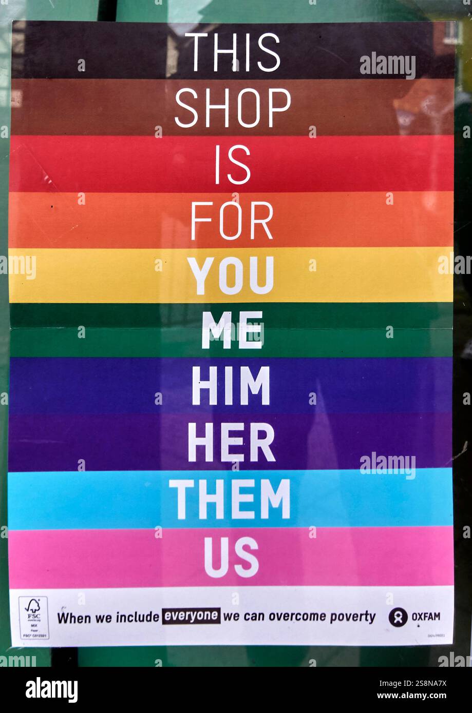 LGBTQ sign in an Oxfam charity shop window welcoming all genders ...
