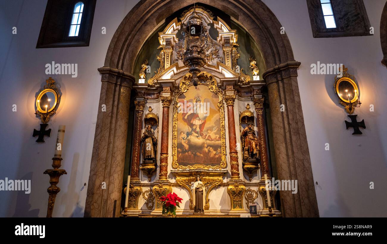 An ornate church altar featuring a large religious painting at its ...