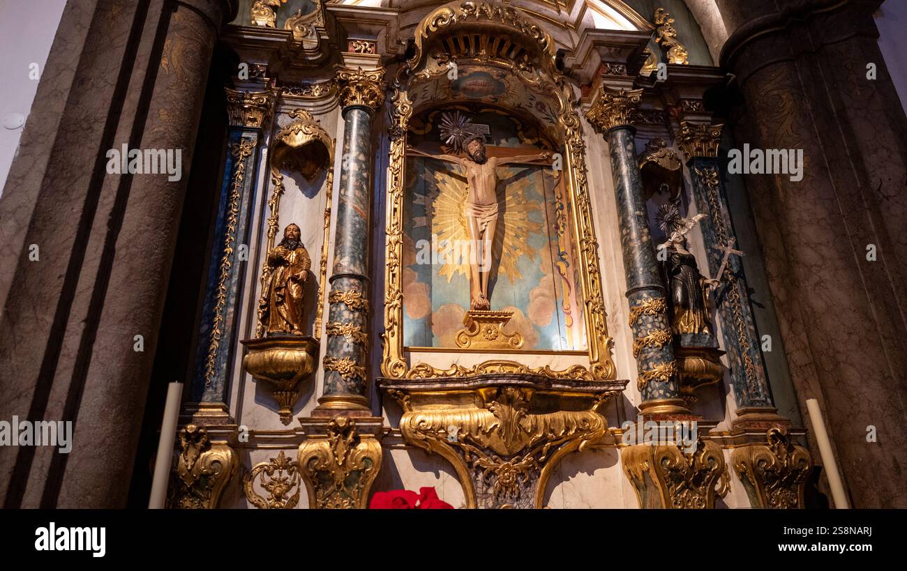A church altar featuring a central crucifix surrounded by intricate ...
