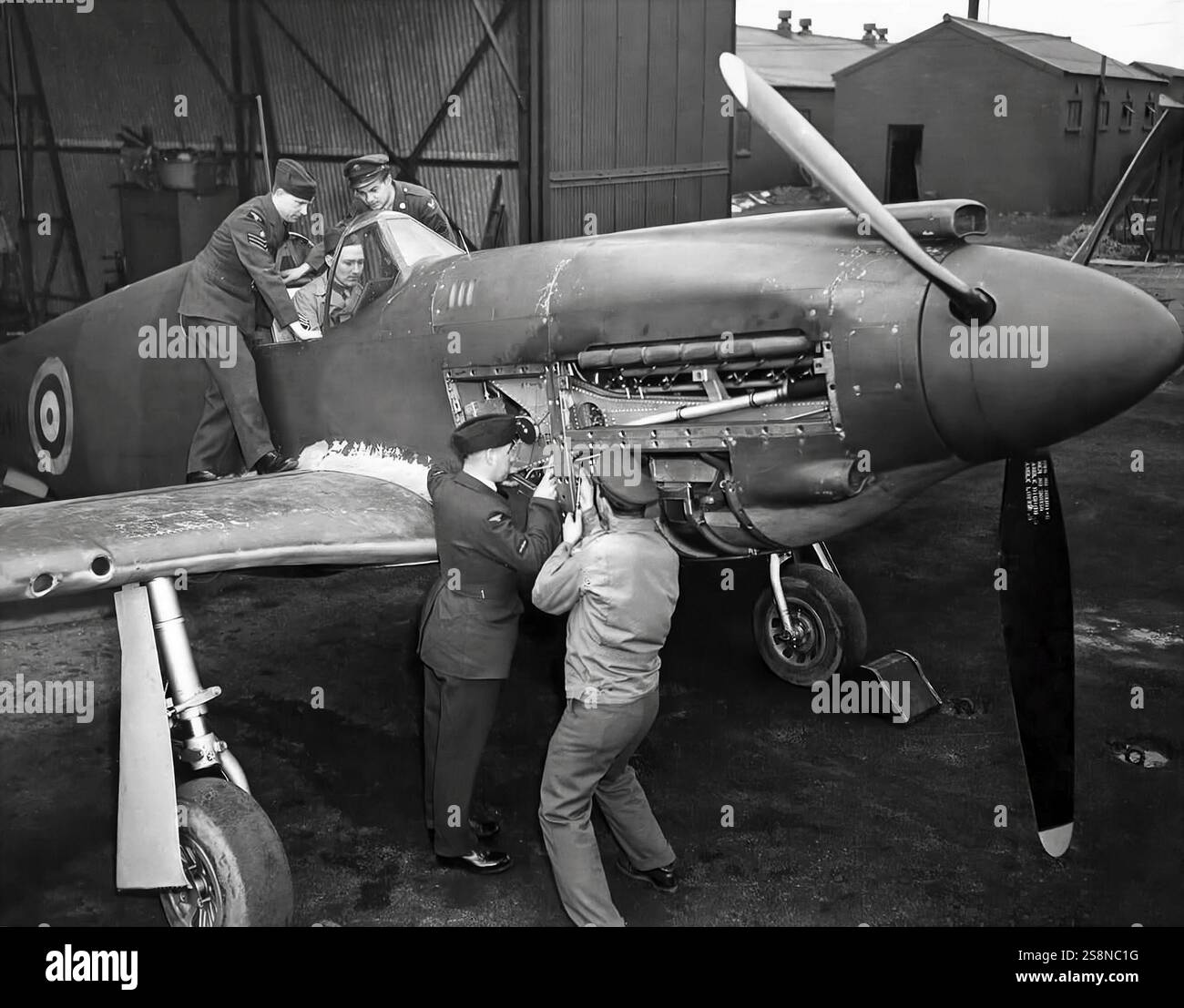 Fitters at RAF Burtonwood Airfield in the north of England, working on ...