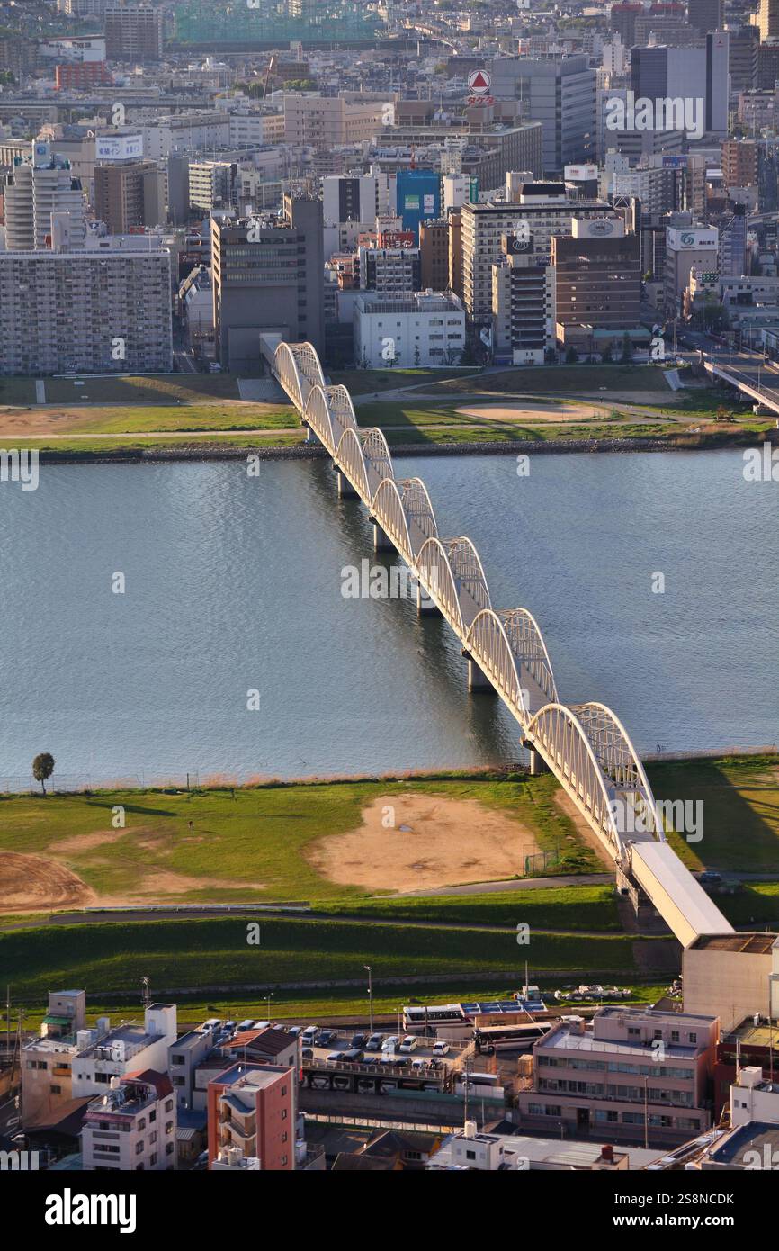 OSAKA, JAPAN - APRIL 27, 2012: Yodo River Bridge in Osaka, Japan. NTT ...