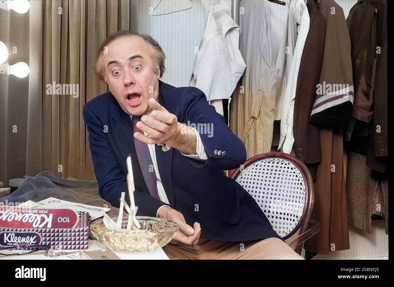 Welsh comedy actor Actor Victor Spinetti throwing away cigarettes on No ...