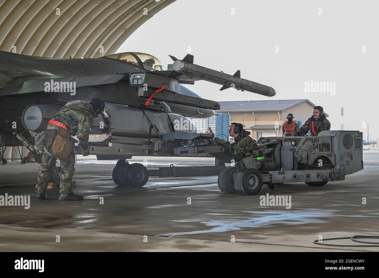 Airman assigned to the 8th Maintenance Group load a Joint Air-to ...