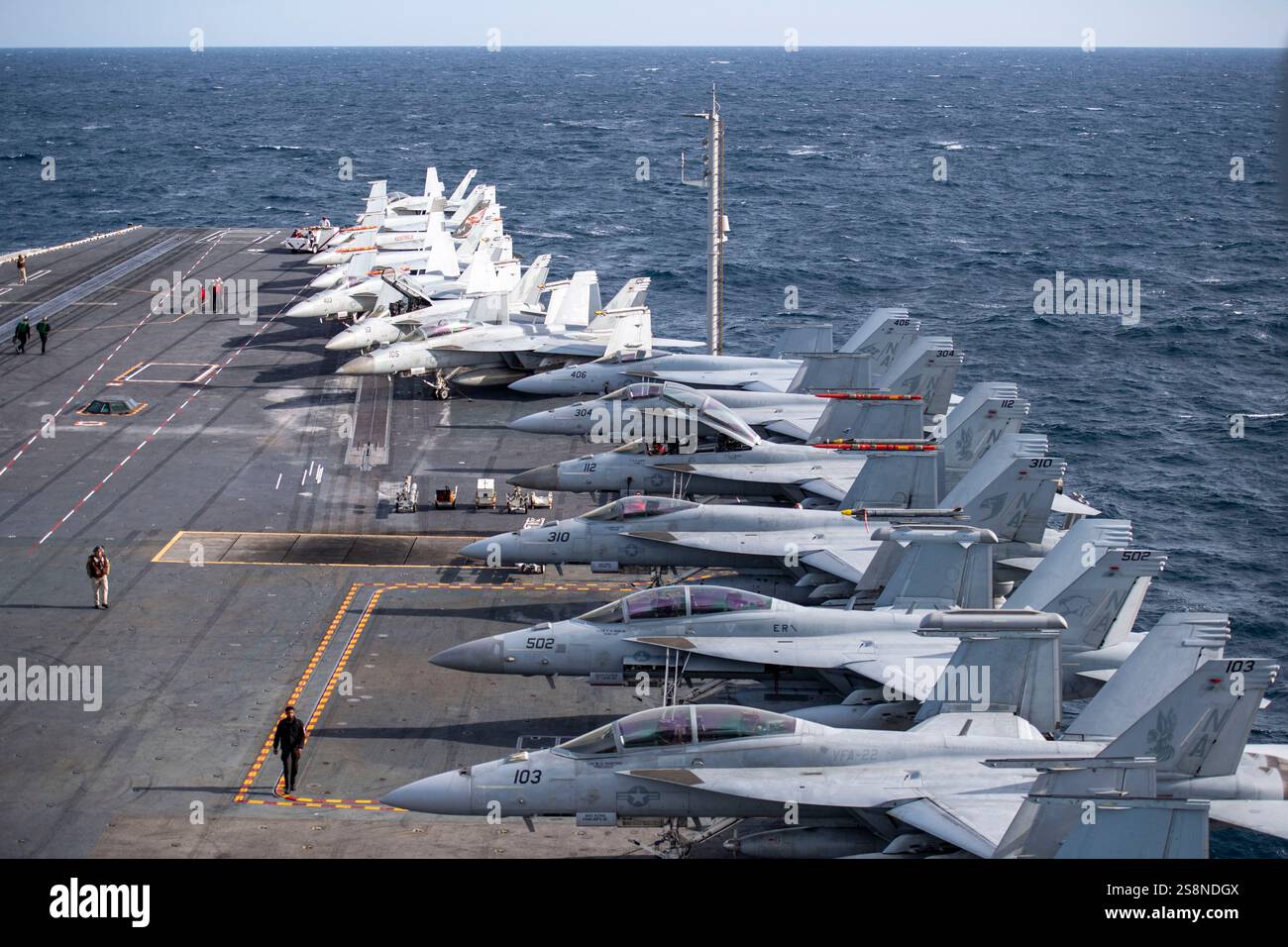 Aircraft from Carrier Airwing (CVW) 17 rest on the flight deck of the ...