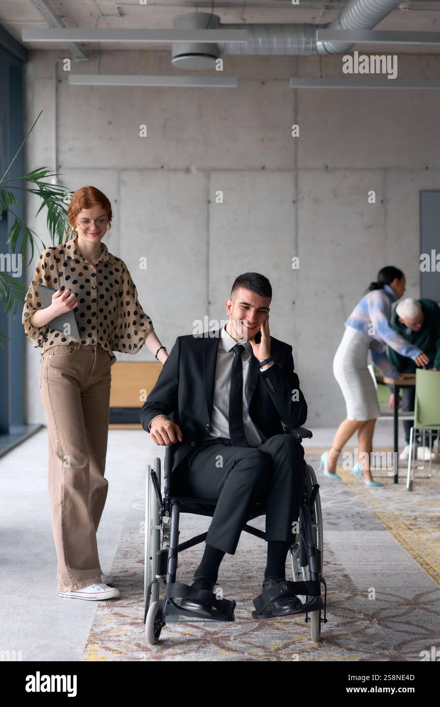 A business director in a wheelchair moves confidently through a modern ...