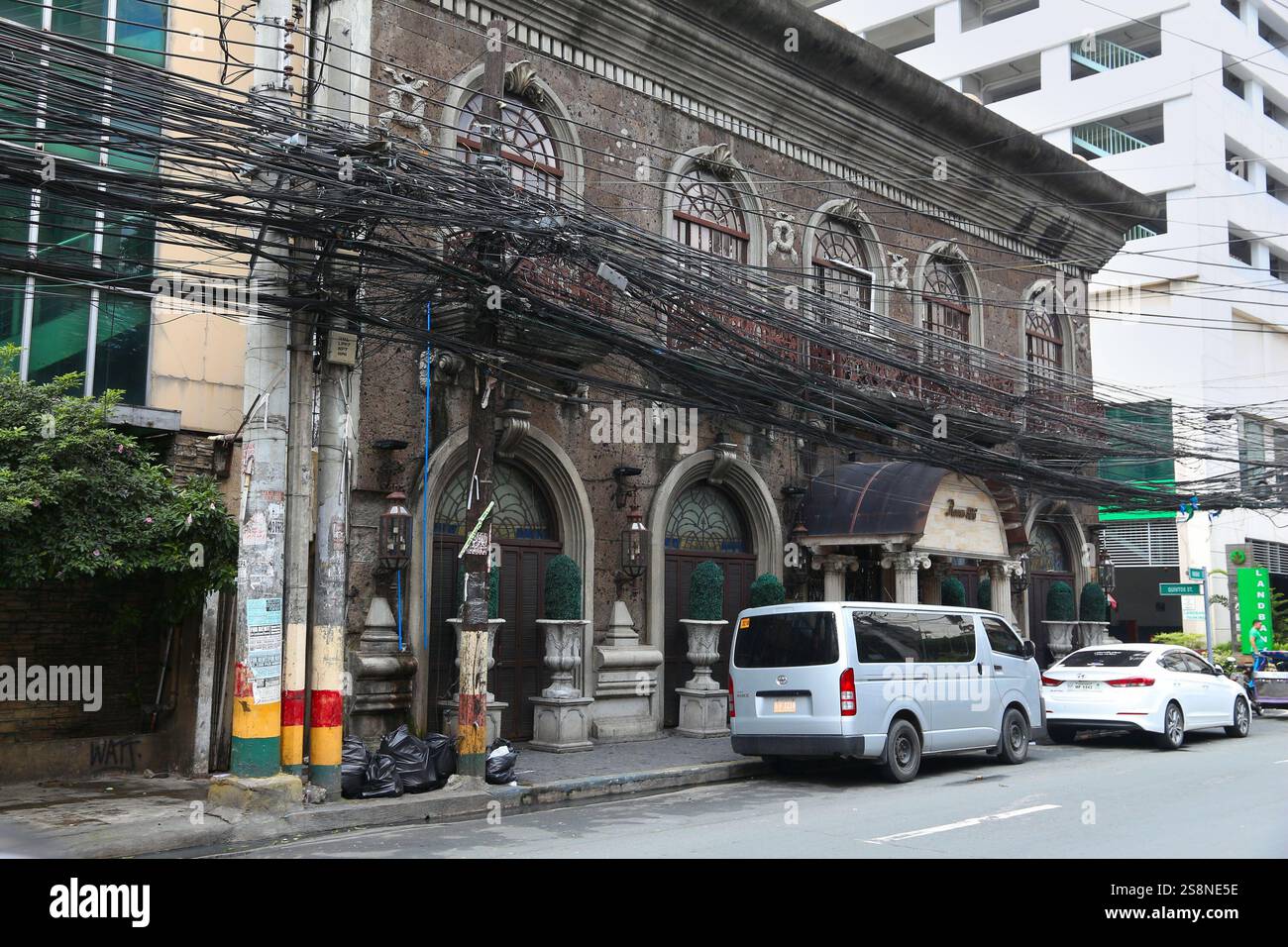 MANILA, PHILIPPINES - NOVEMBER 25, 2017: Tangled cables and chaotic ...