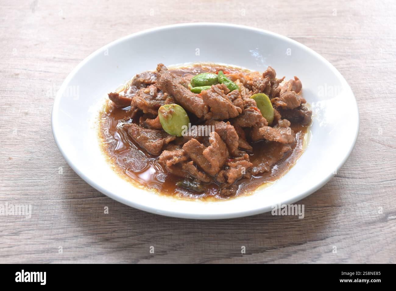 spicy stir fried slice pork with stink bean and chili in shrimp paste ...