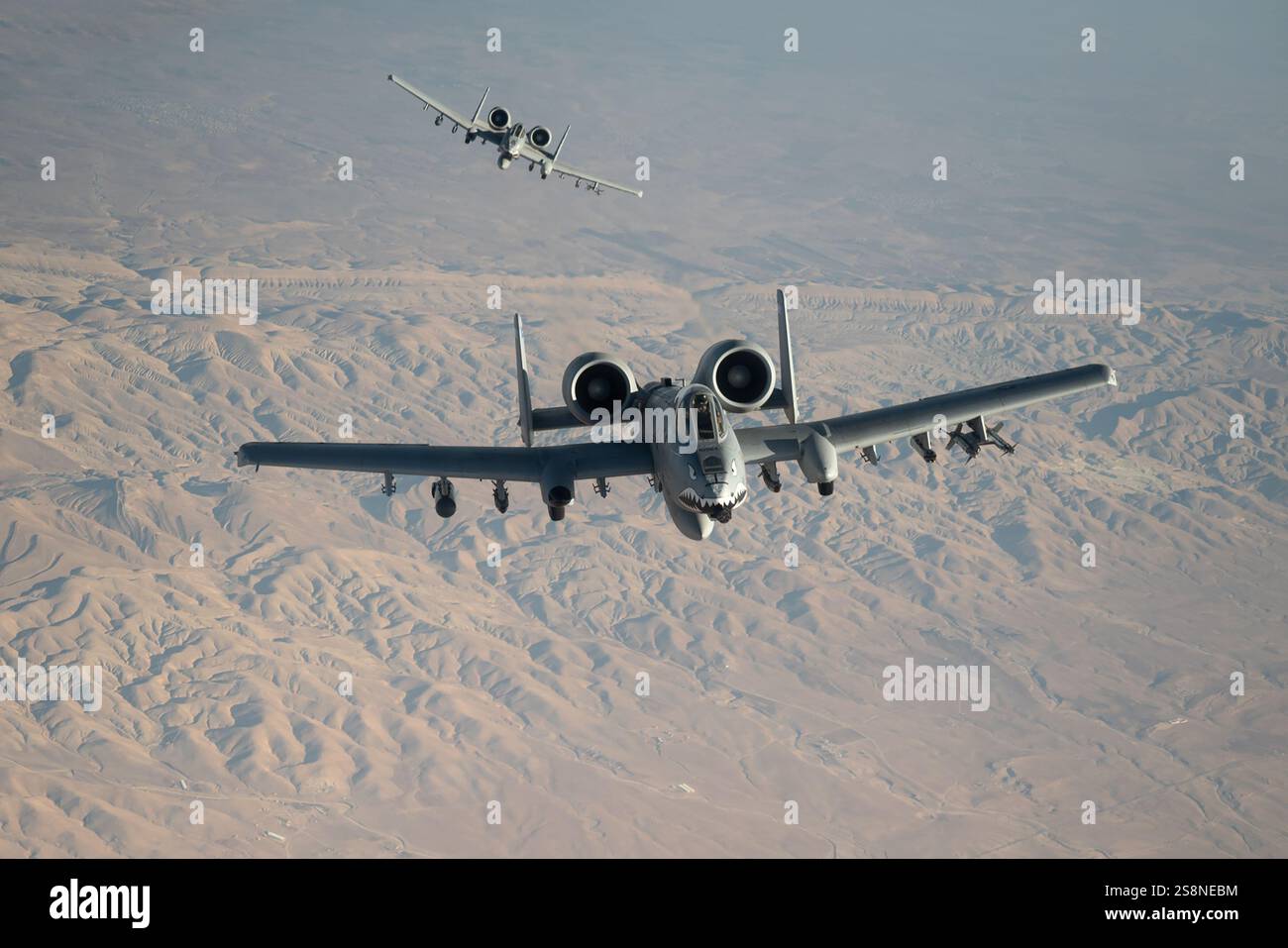 Two U.S. Air Force A-10 Thunderbolt IIs conduct a routine combat air ...