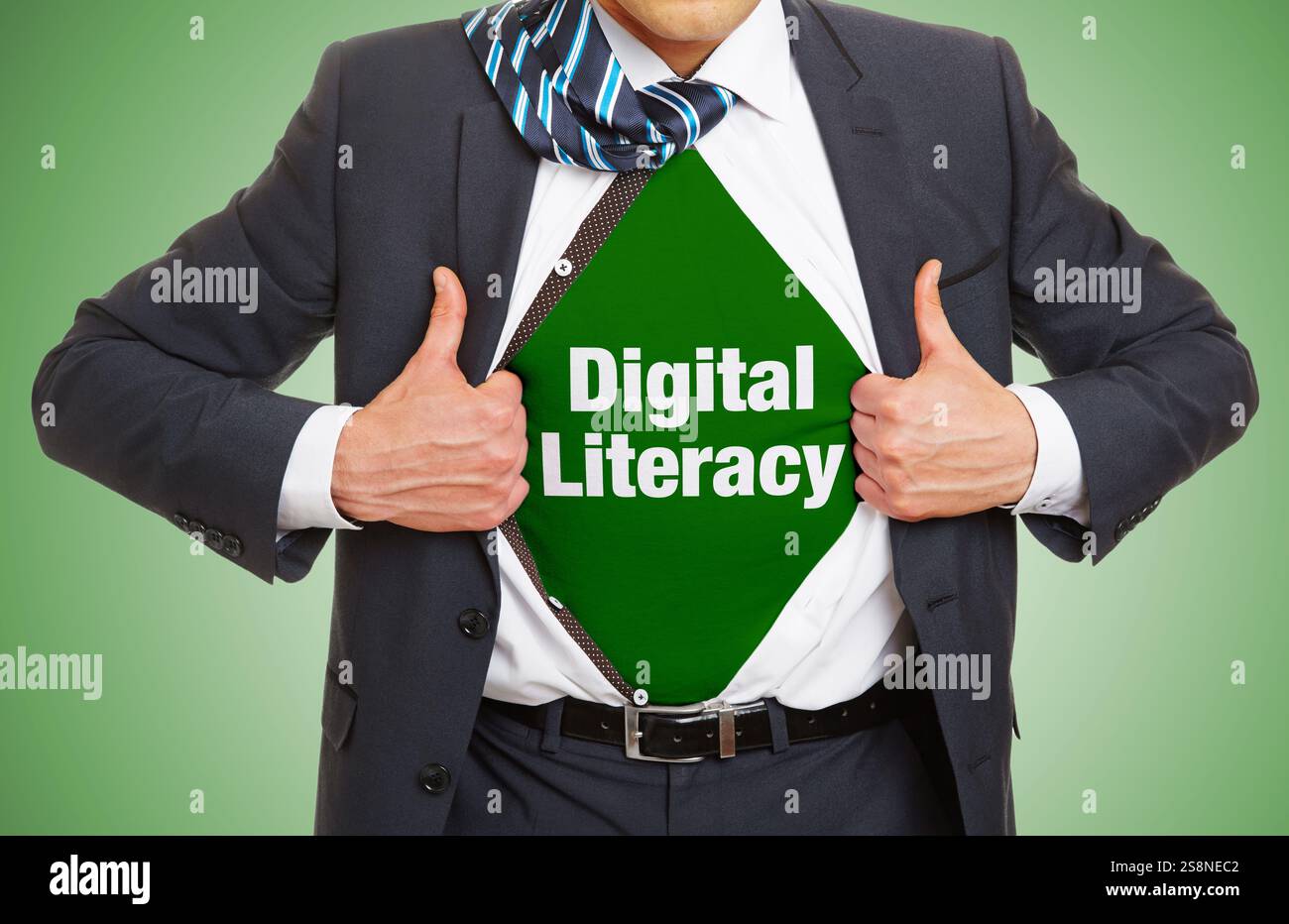 Businessman shows the lettering “Digital Literarcy” under a suit as a ...