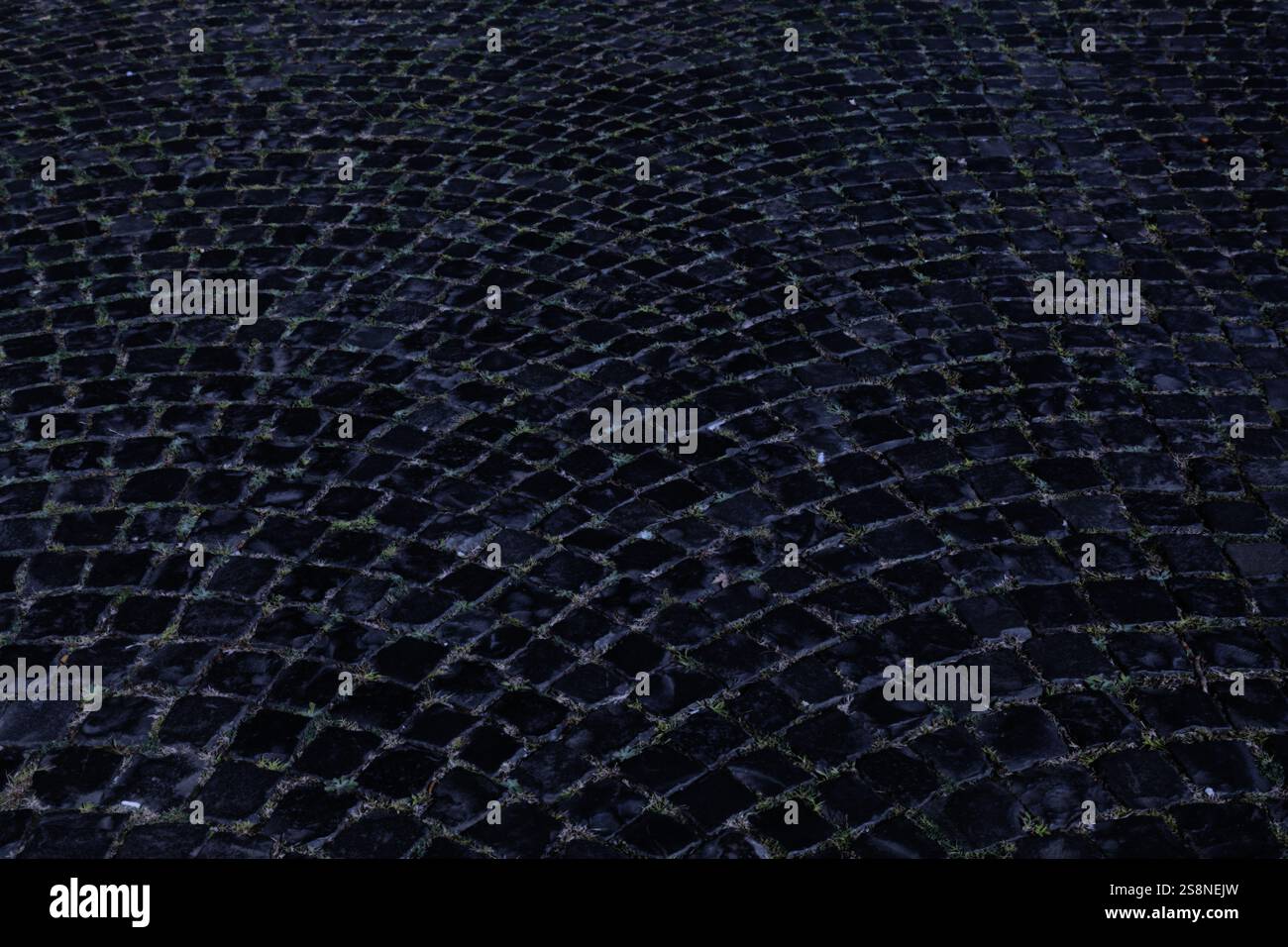 Stone paved street night background. Old stone pavement. Cobblestone in ...