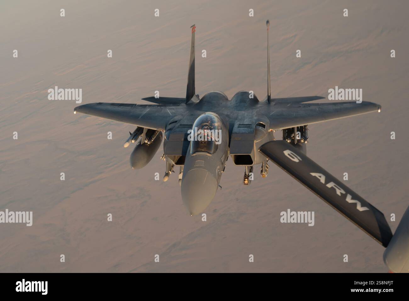 A U.S. Air Force F-15E Strike Eagle prepares to be refueled over the U ...
