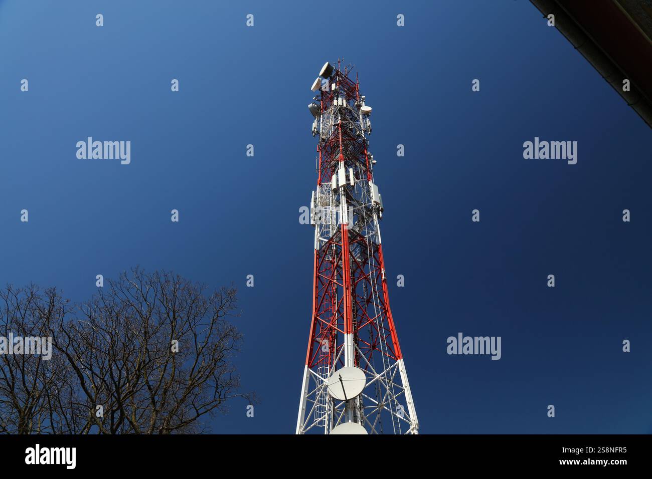 Telecom base station in Poland. Cell tower sector antennas. Mobile 5G transmitter equipment ...