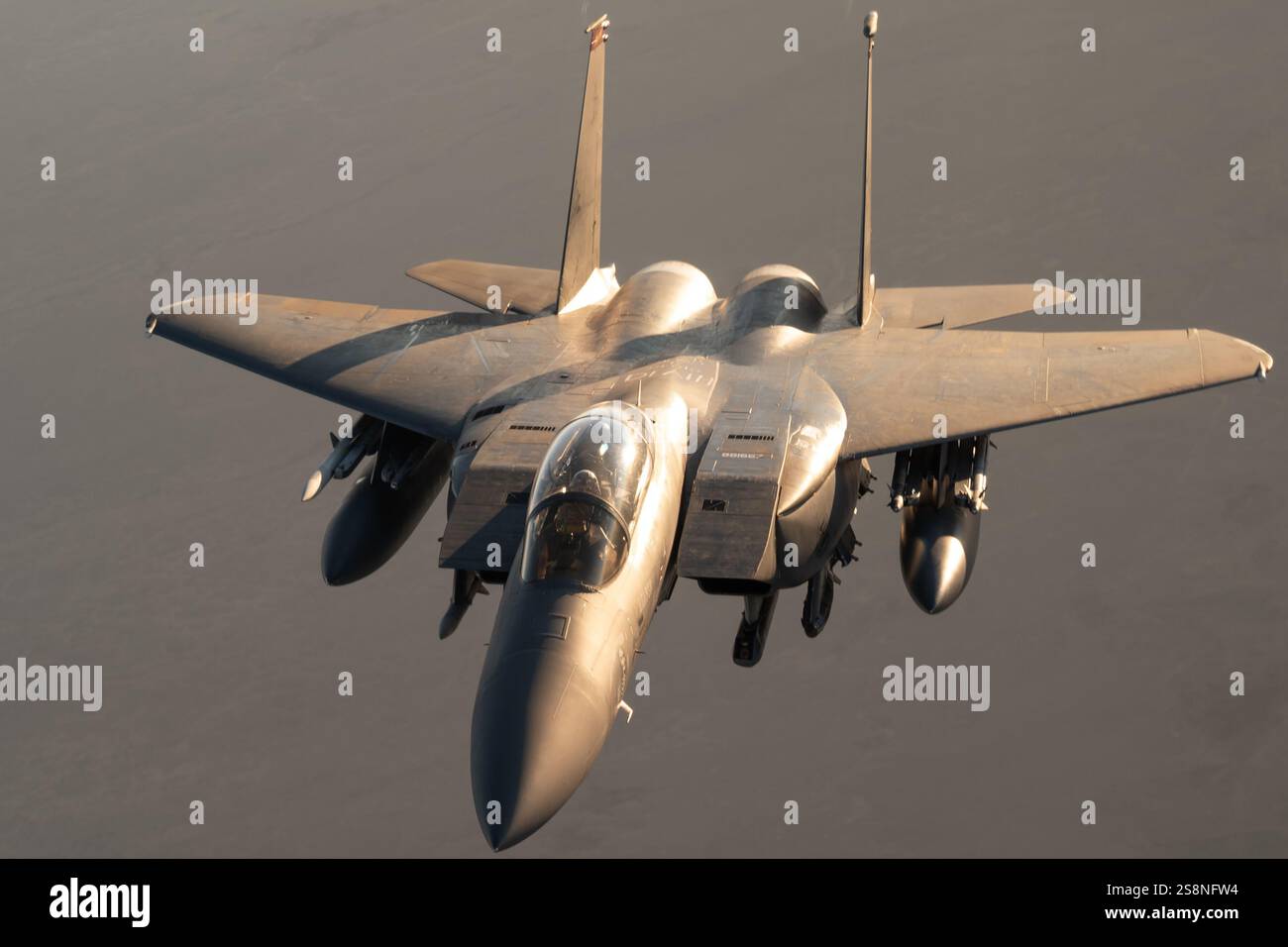 A U.S. Air Force F-15E Strike Eagle conducts combat air patrols over the U.S. Central Command ...