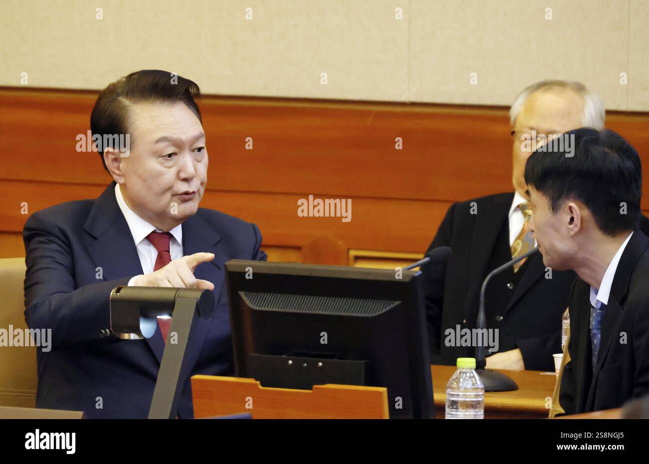 Impeached South Korean President Yoon Suk Yeol (L) attends a hearing in his impeachment trial at ...