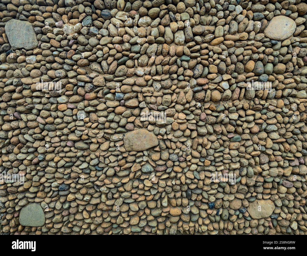 Stone Wall Symmetry – Solid Structure of Tiny Rocks Stock Photo - Alamy
