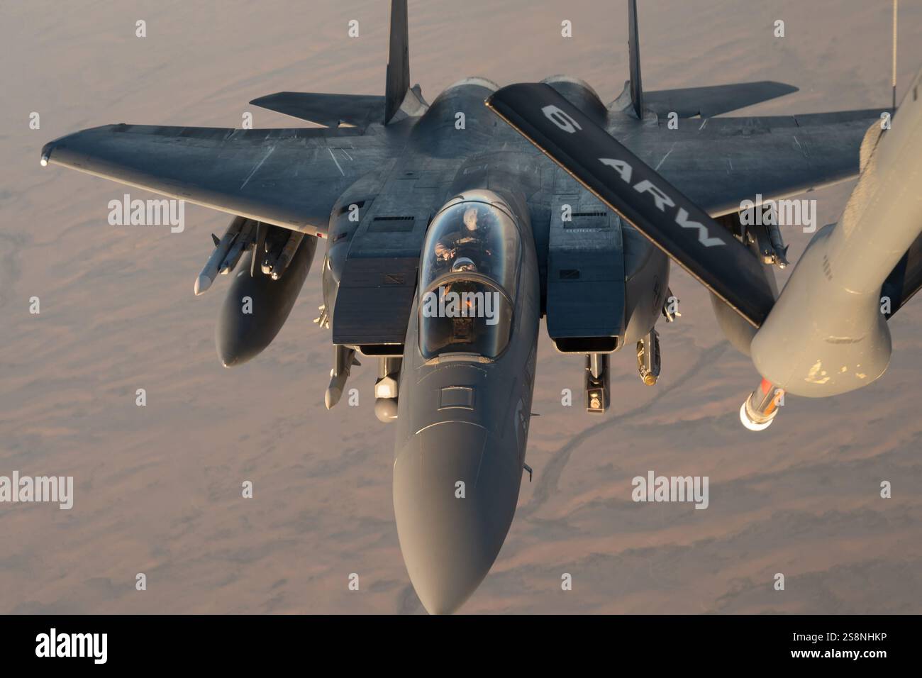 A U.S. Air Force F-15E Strike Eagle prepares to be refueled over the U ...
