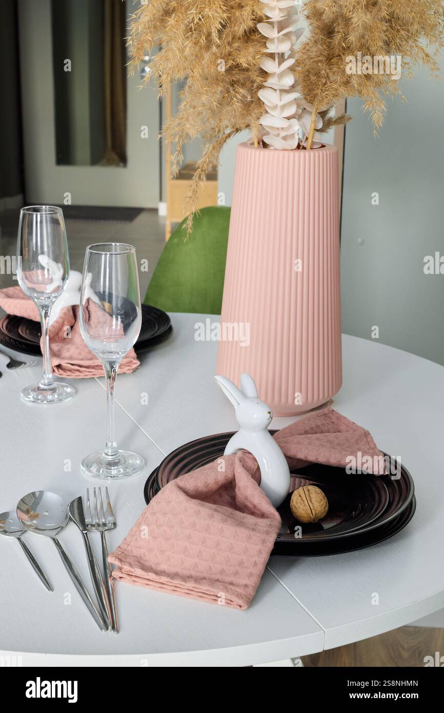 An Elegant Table Setting featuring a Decorative Rabbit alongside a ...