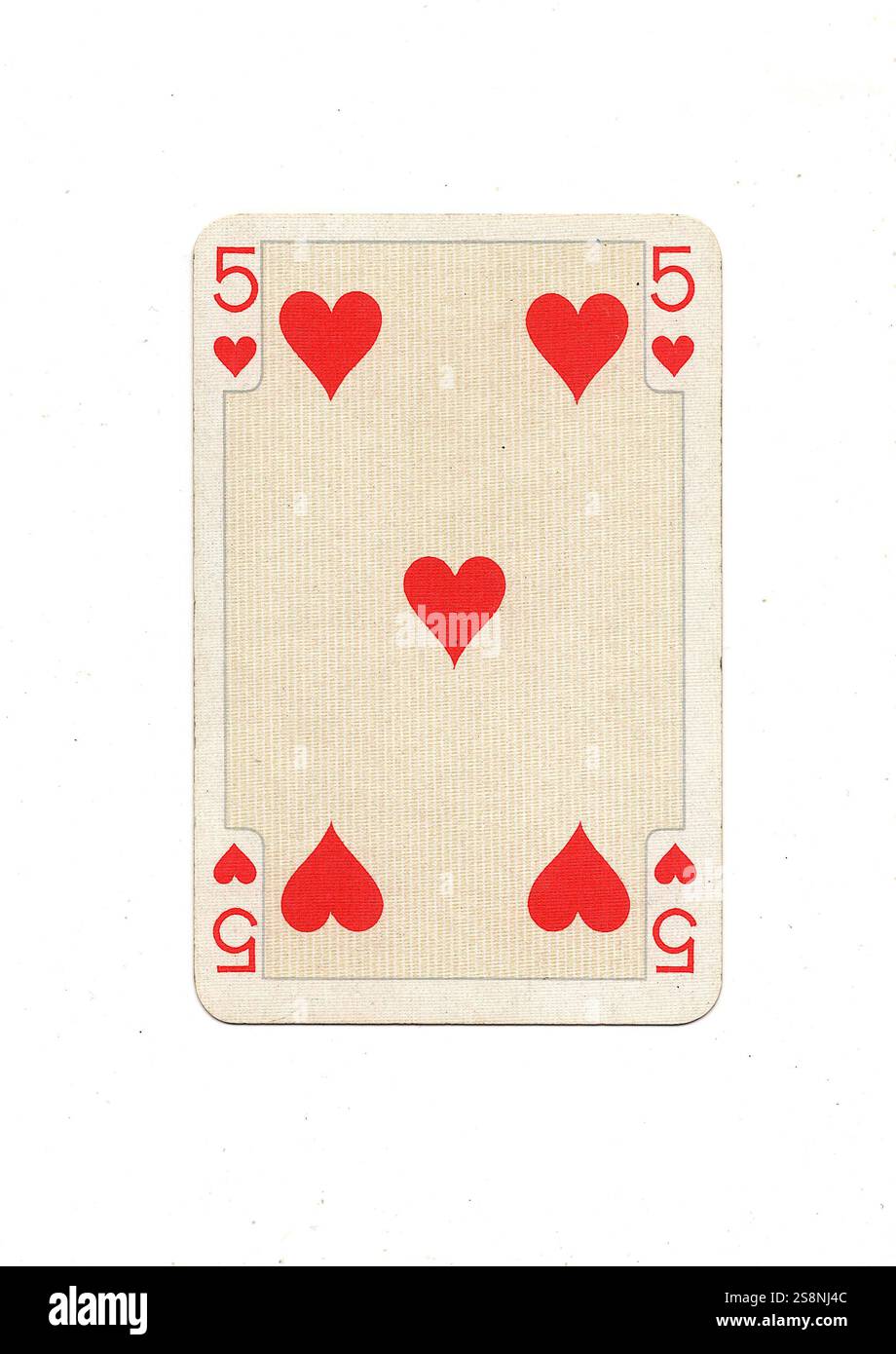 An antique five of hearts playing card isolated on a white background ...