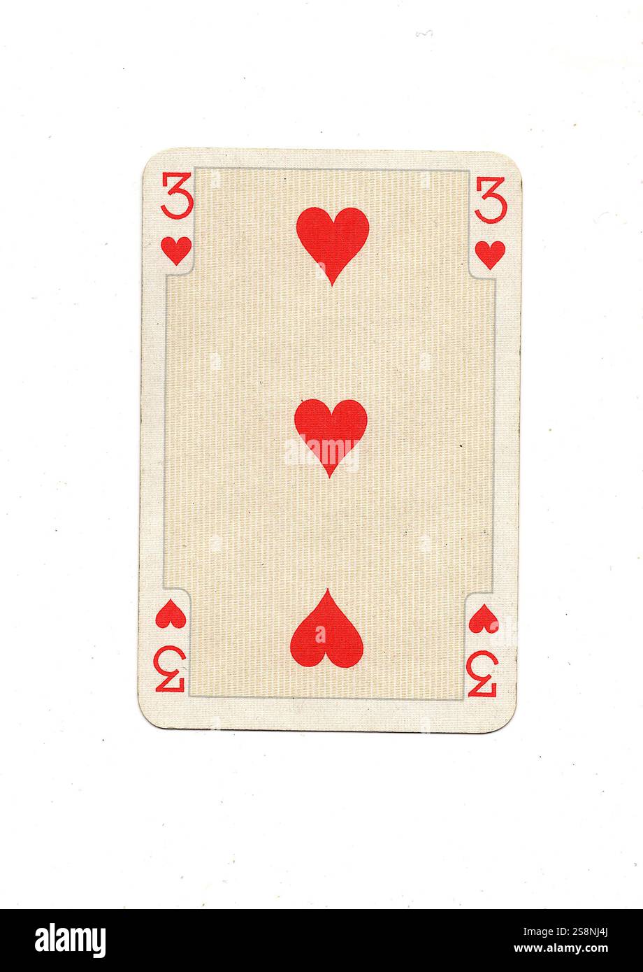 An antique three of hearts playing card isolated on a white background ...