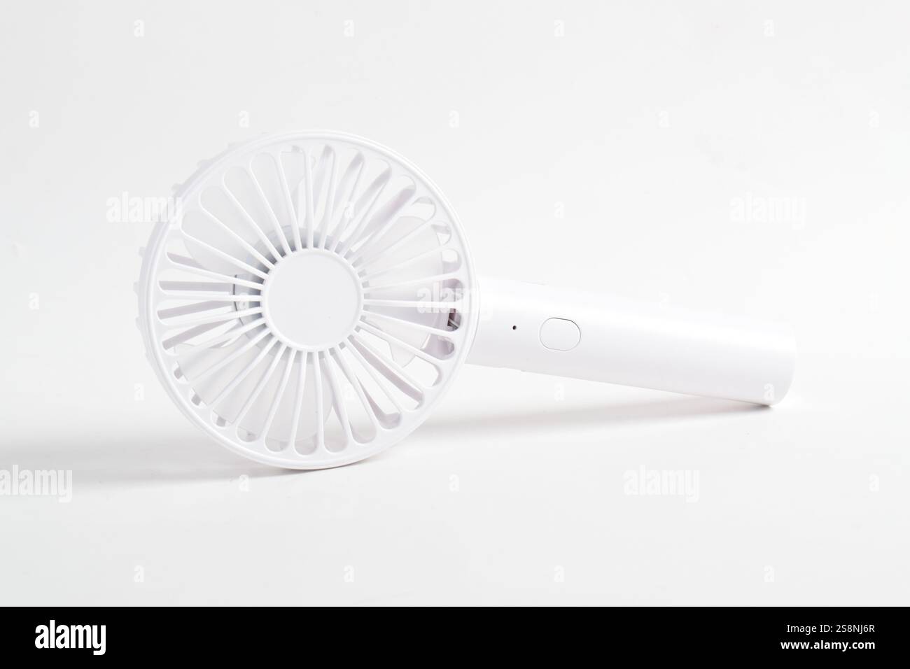 Mini electric white fan with handle isolated on white background Stock ...