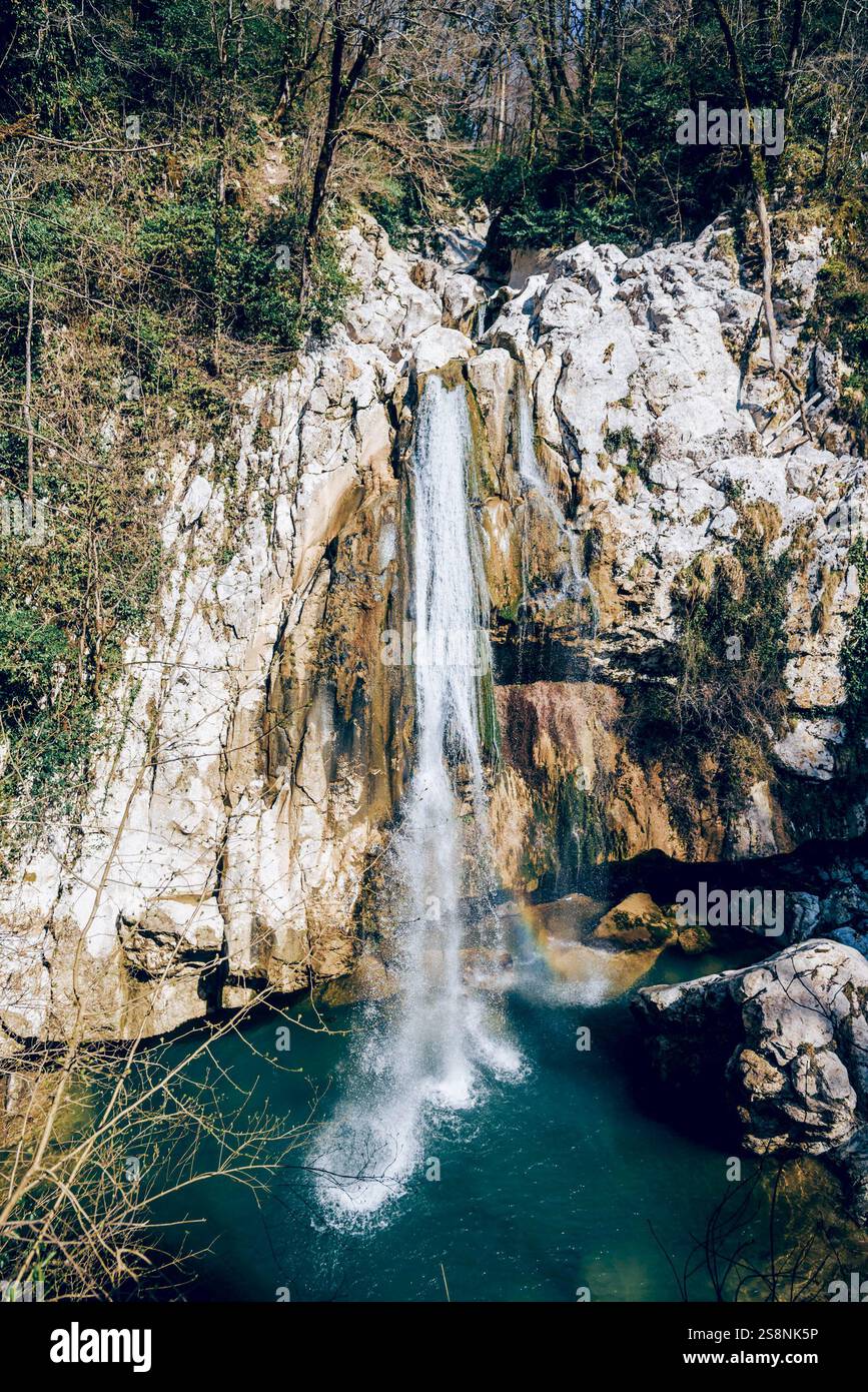 Picturesque waterfall cascade with a powerful flow of water, a ...
