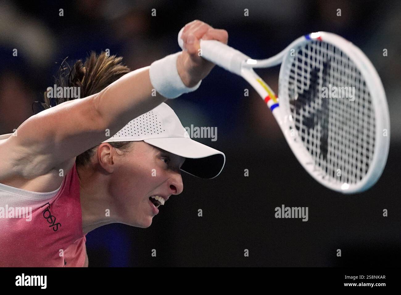 Iga Swiatek of Poland serves to Madison Keys of the U.S. during their ...