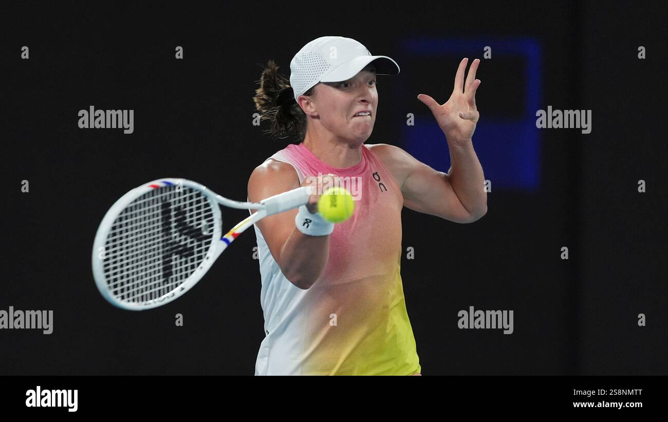 Iga Swiatek of Poland plays a forehand return to Madison Keys of the U ...