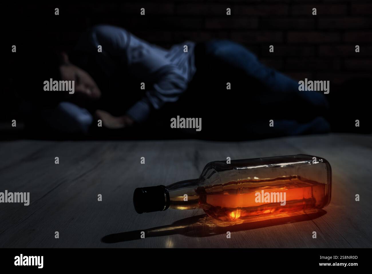 Unhappy man lying on floor hi-res stock photography and images - Alamy