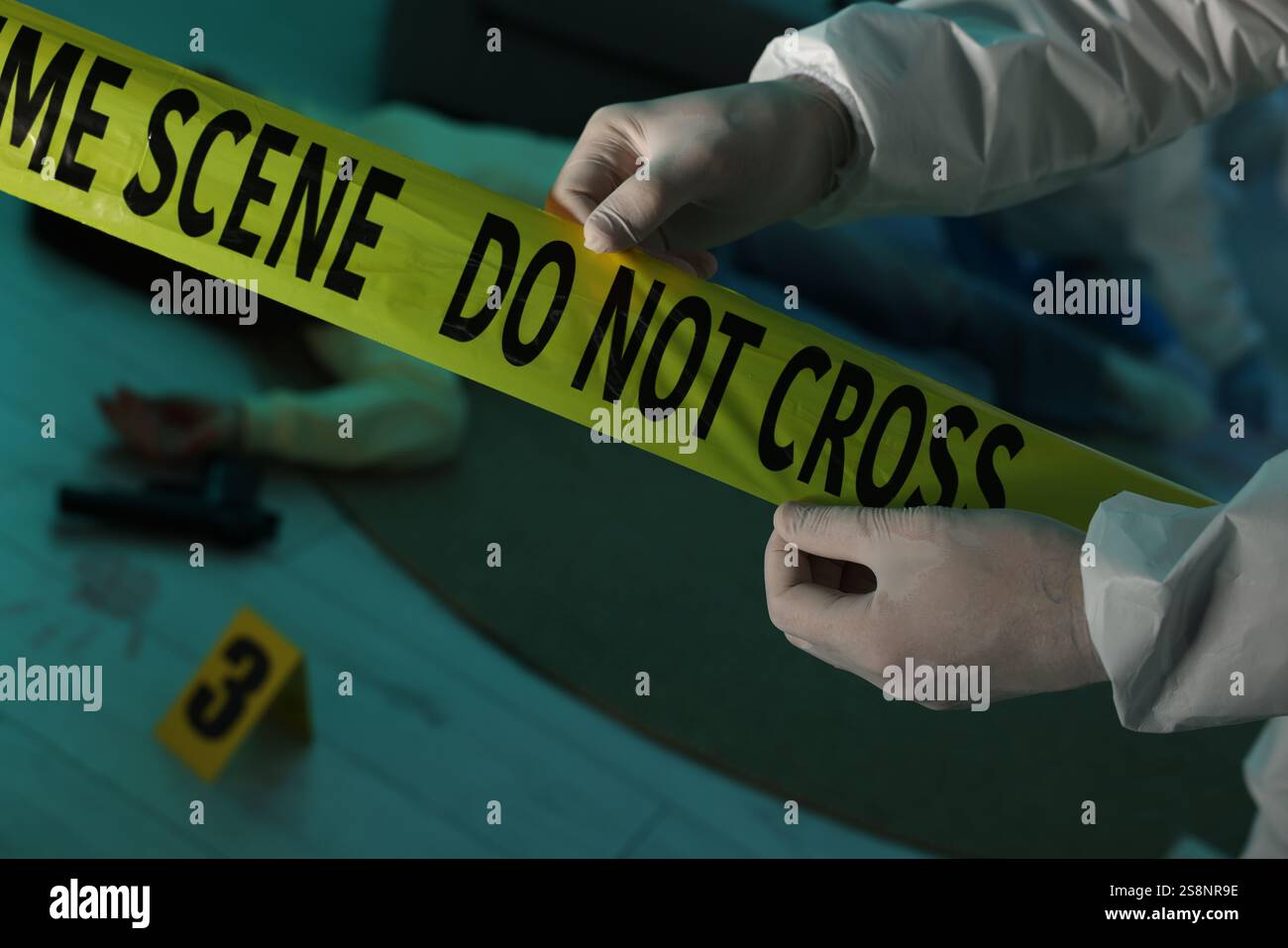 Forensic expert with yellow crime scene tape and dead woman's body ...