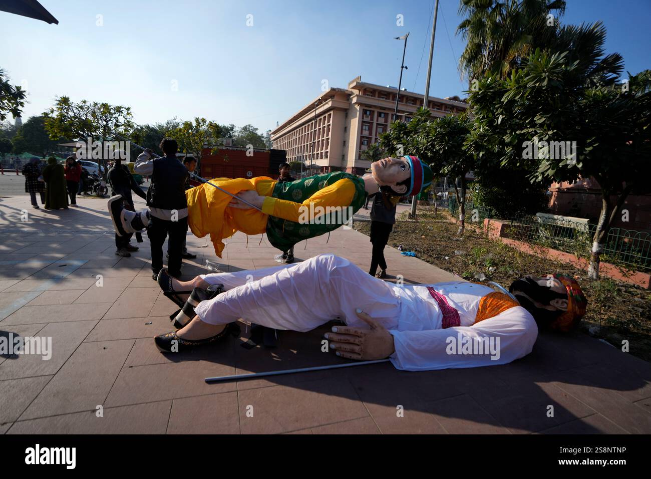 Workers carry elements for preparation ahead of the annual Republic Day ...