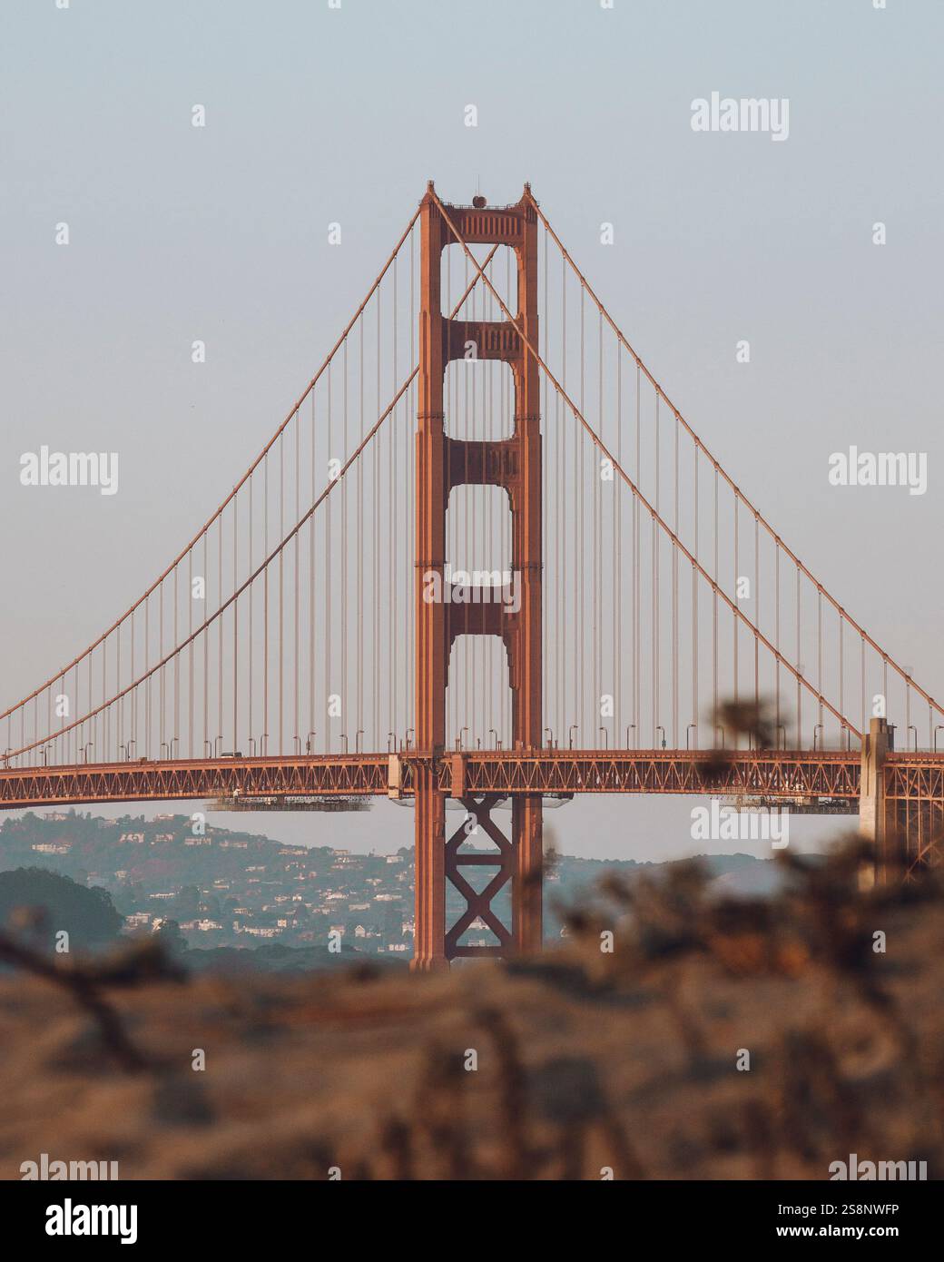 Close-up photograph of the Golden Gate Bridge at sunset, with the ...
